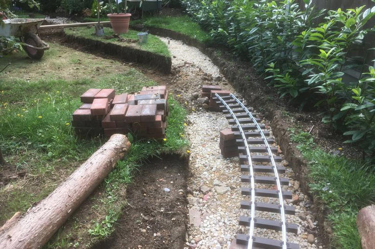 Essex couple build 'magical' railway in garden with tunnel and five engines