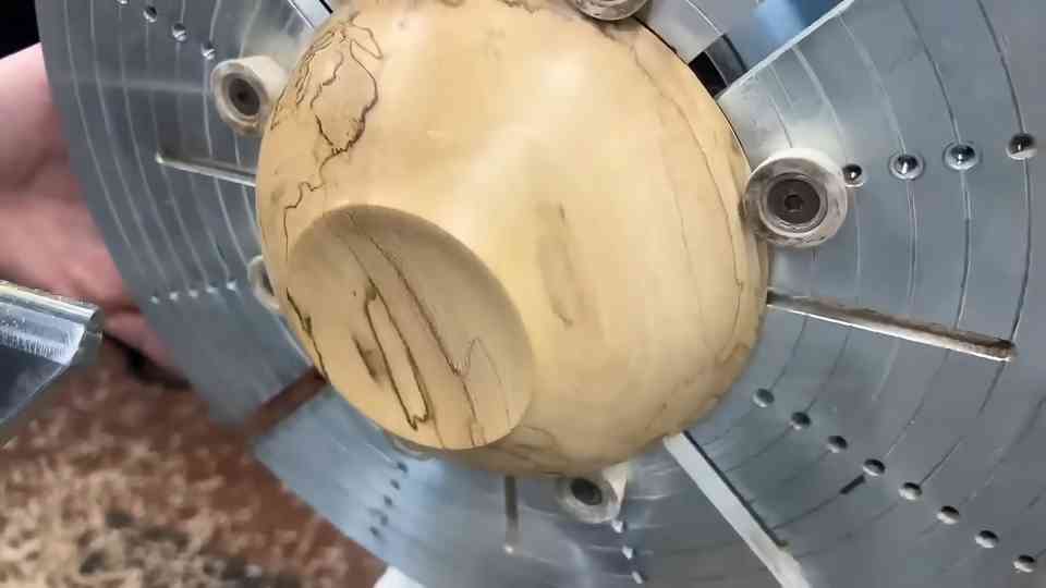 Watch what happens when a potato meets a spinning wood lathe
