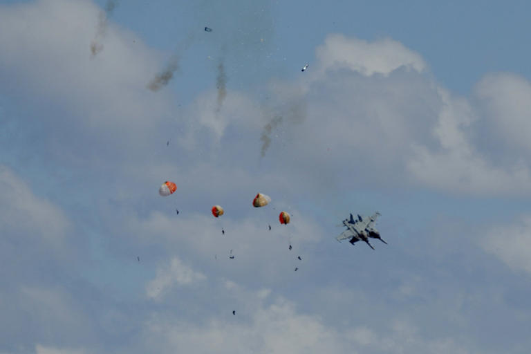 Two fighter jets crash into each other in mid-air