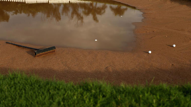 My club touched the sand in a bunker when I was measuring my relief ...