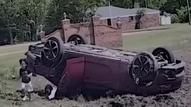Moment toddler, 3, crawls out of upside down car wreckage after police ...
