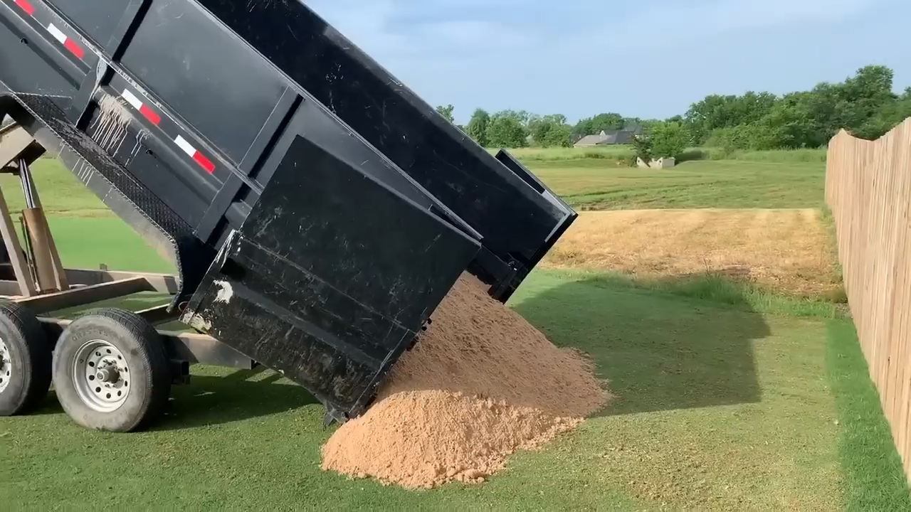 I thought leveling my lawn would be easy - 6 tons of sand later, I'm ...