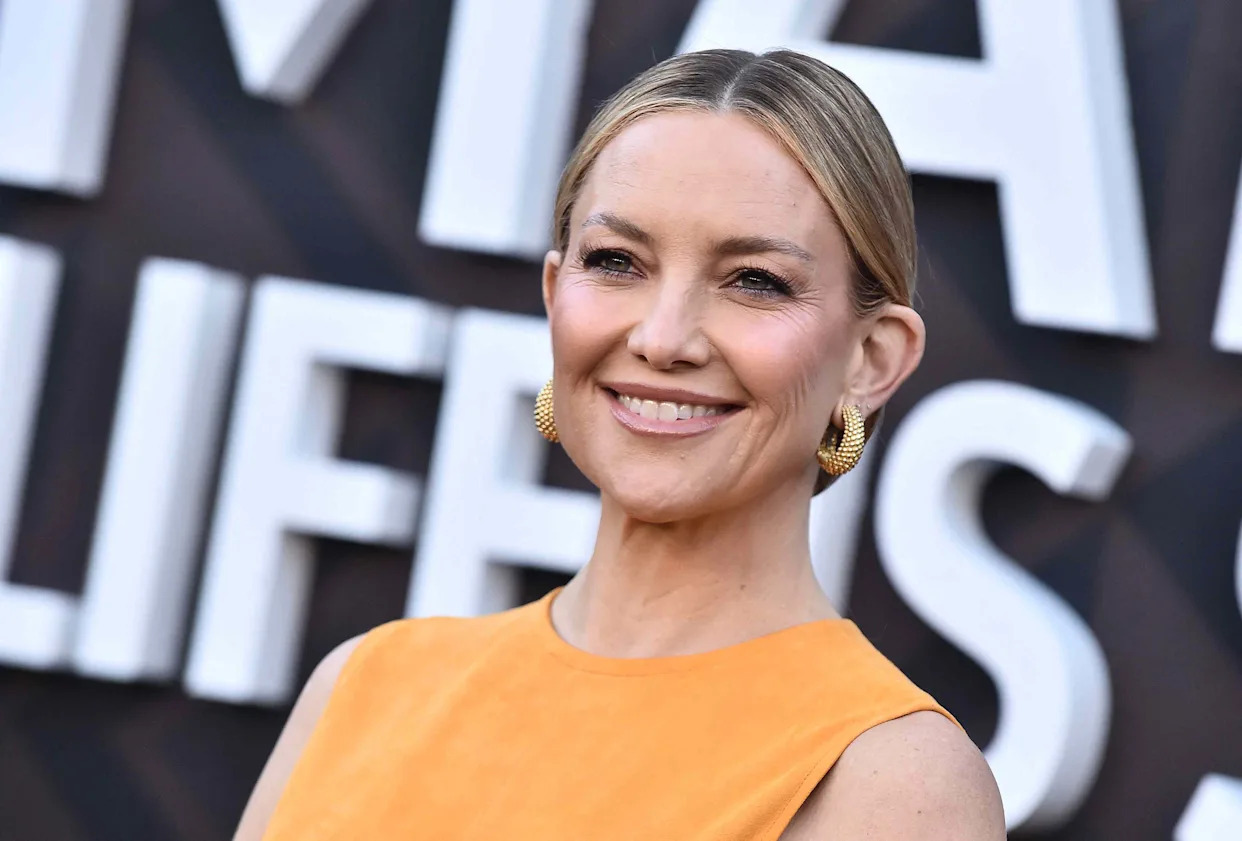 At 47, Kate Hudson lights up the red carpet in a saffron dress
