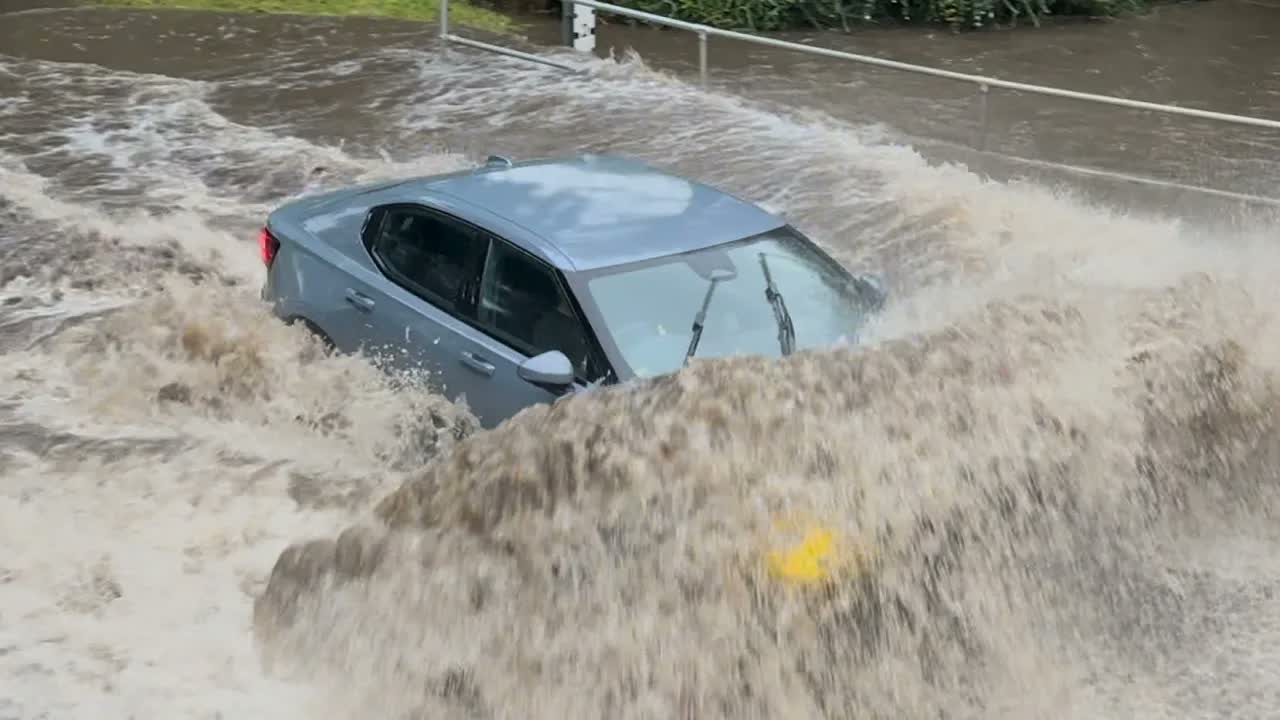 Bro hit the flood at full speed like his sedan suddenly became a battleship