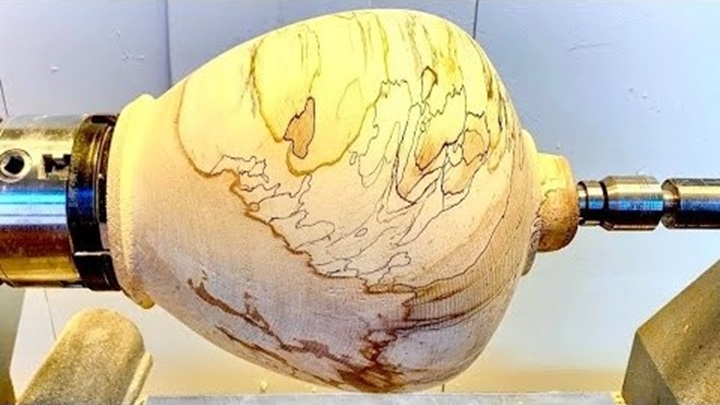 This rough wood looked damaged until the lathe revealed the grain