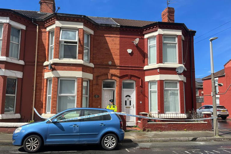 Neighbour 'hammered' on door moments before police descended on quiet road