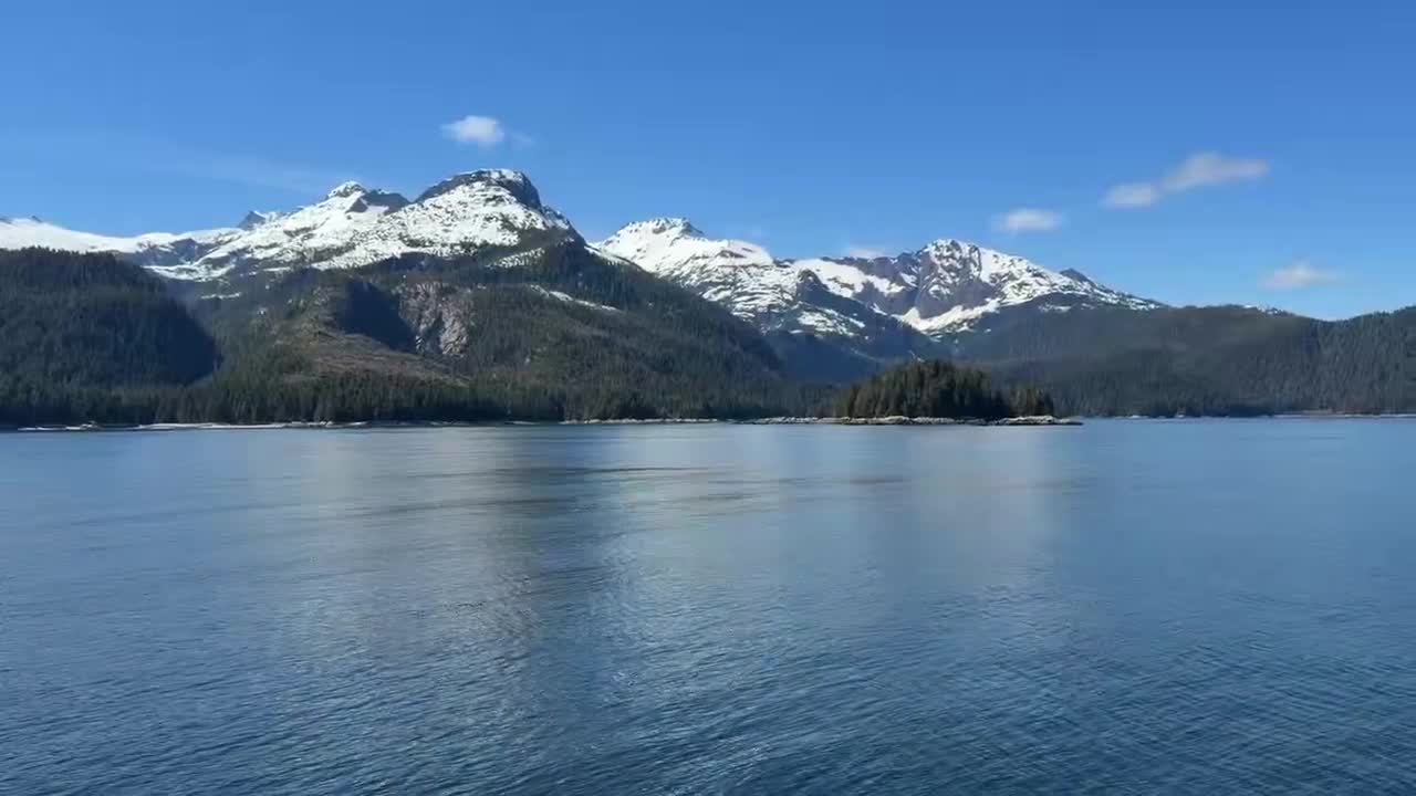 Clear skies and calm waters surround Mist Cove in Tongass National ...