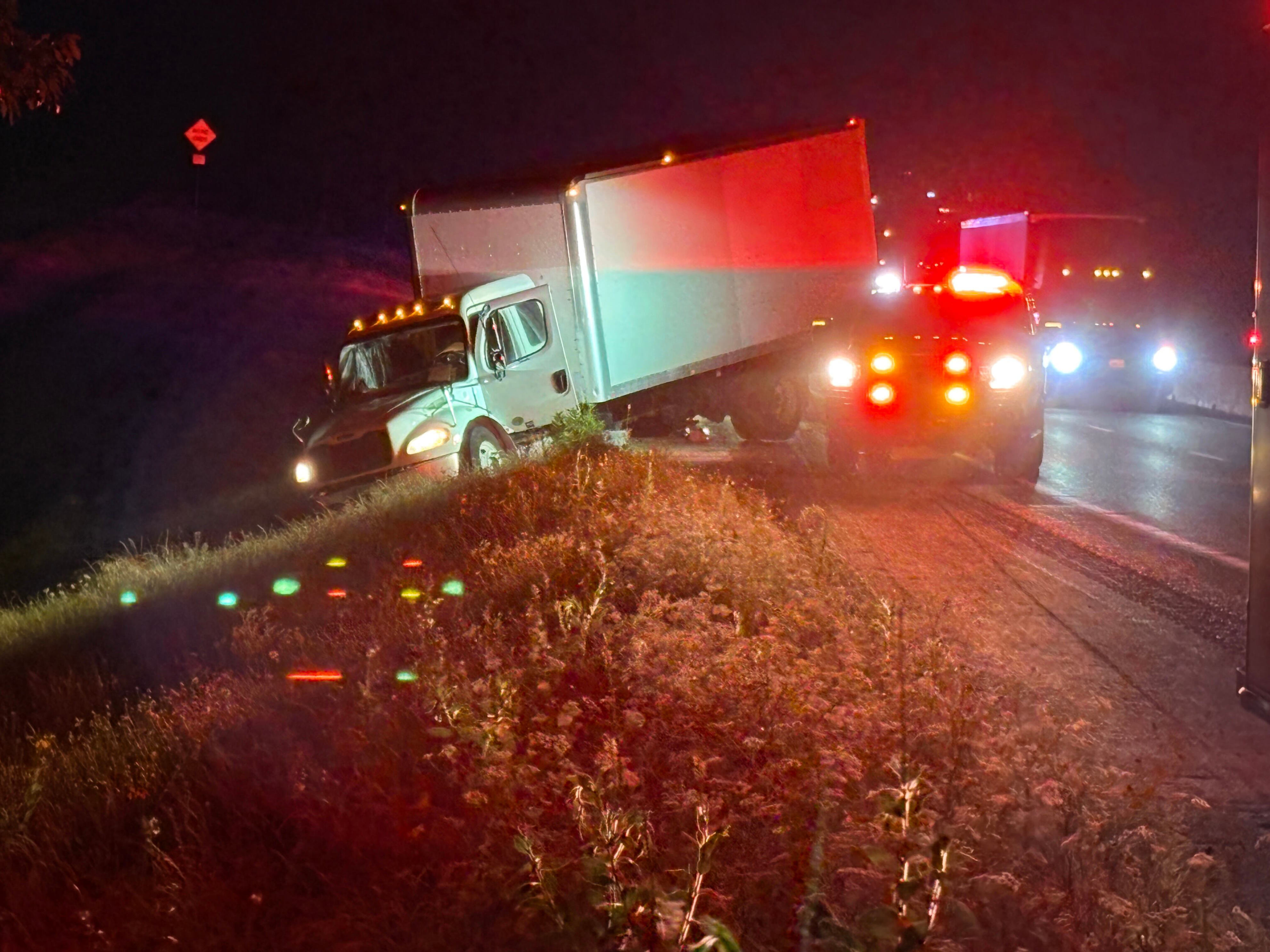 Box truck hanging partially over bridge spurs emergency response on I-20