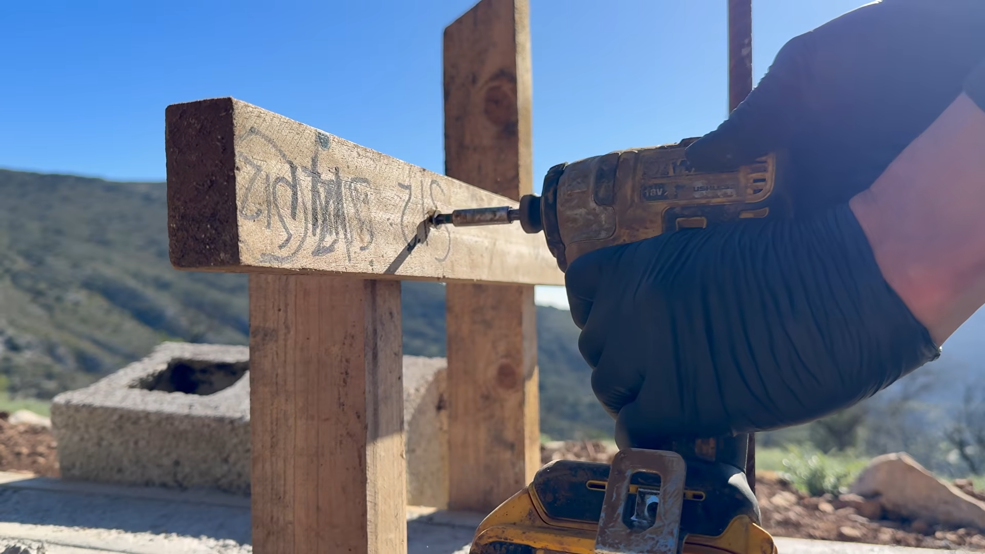 Beginning construction on a wooden greenhouse frame