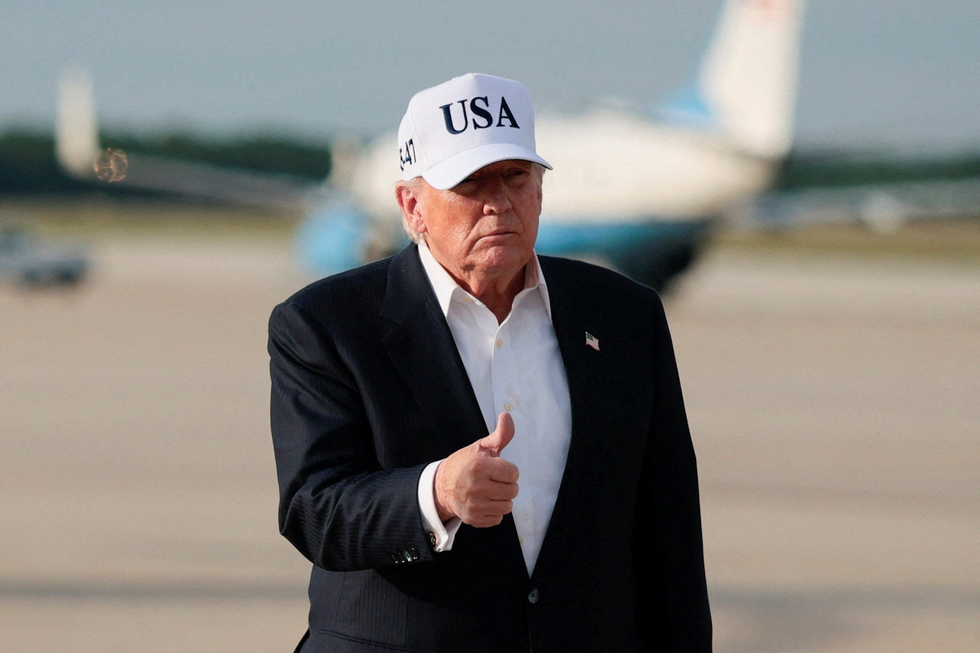 Trump posts AI-generated image of himself beside a shackled alien