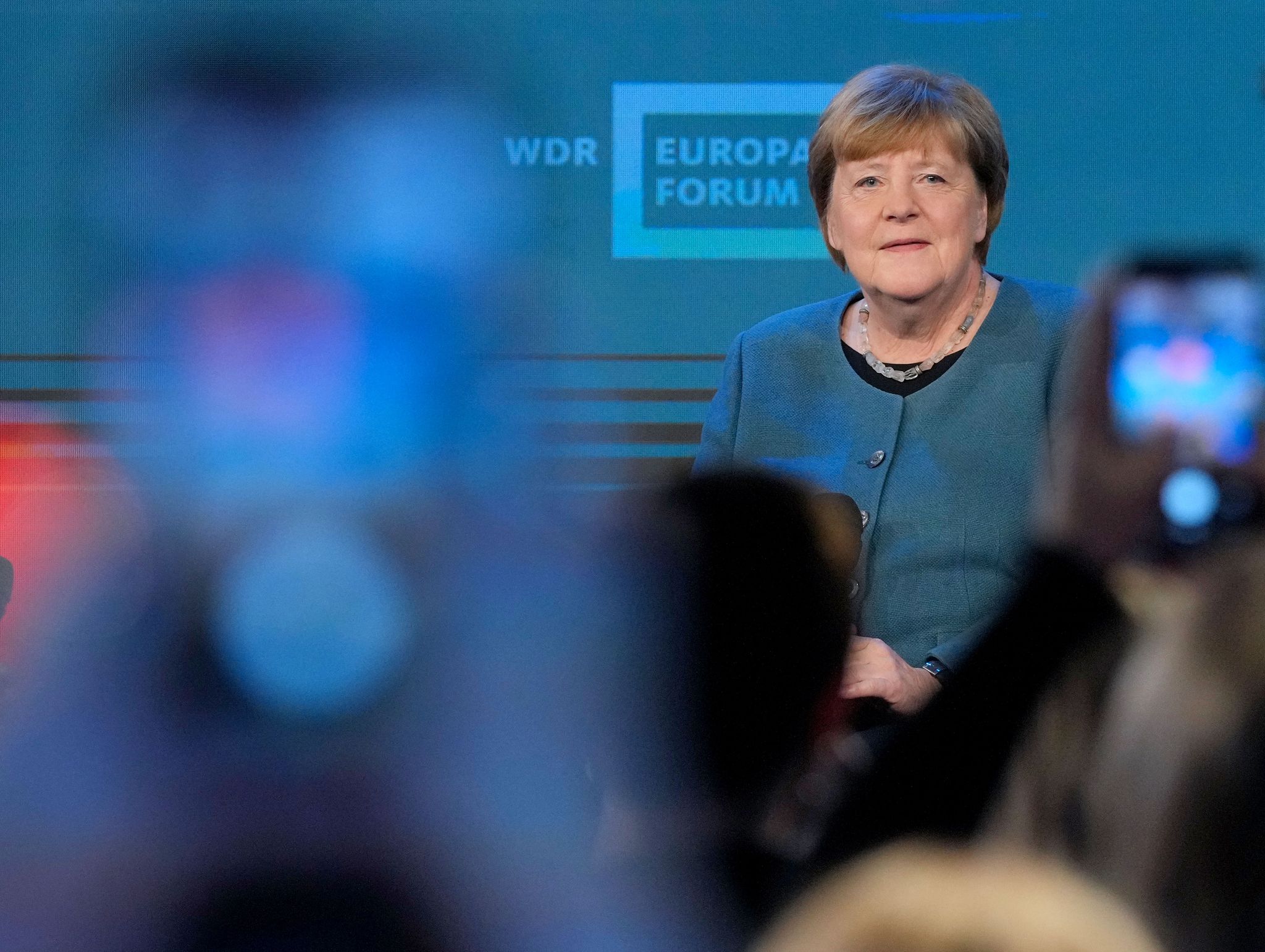 Merkel warns against retreat on fighting global warming