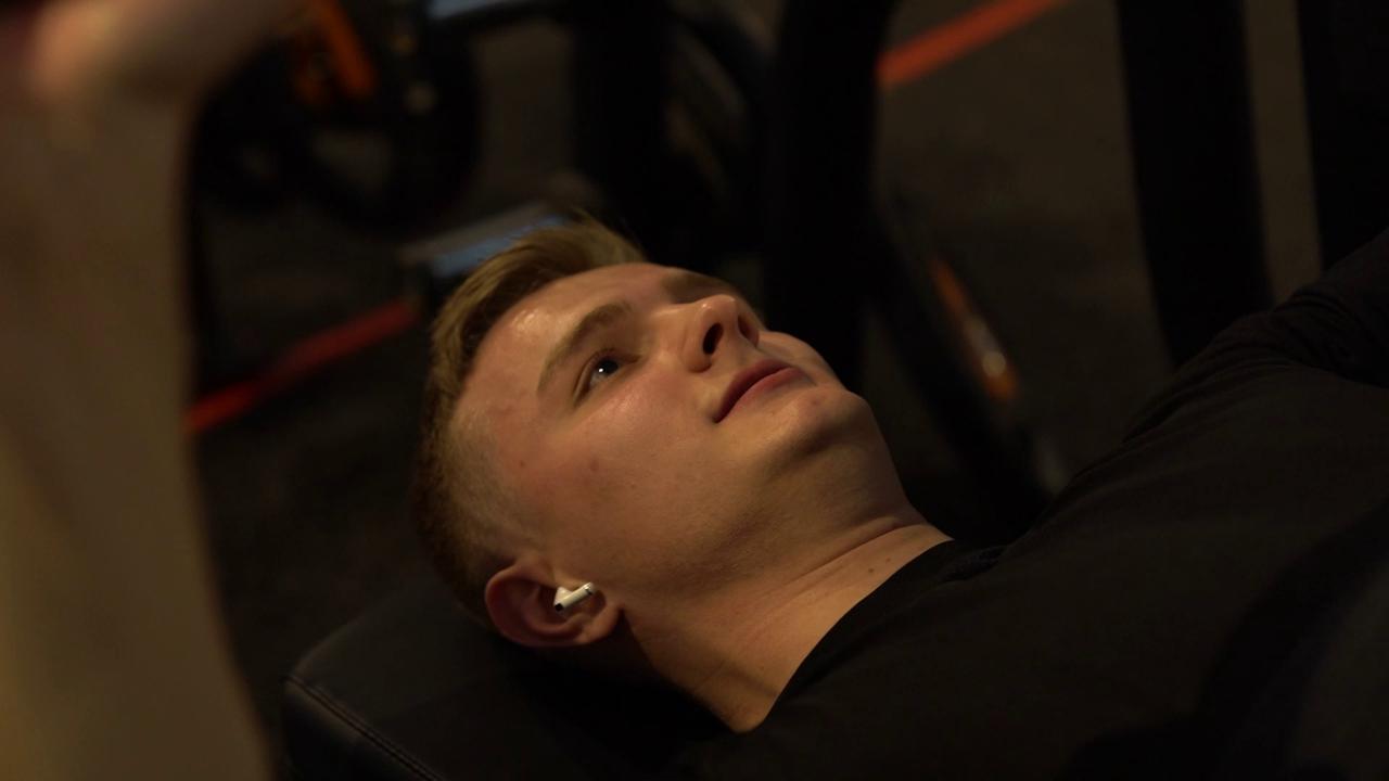 Doing Pull Up Using The Chest Press At The Gym