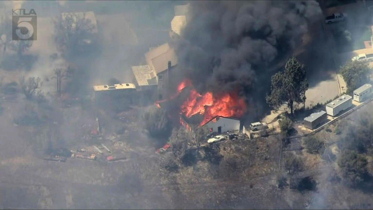 Photos: Brush fire torches structures, forces evacuations in Simi Valley