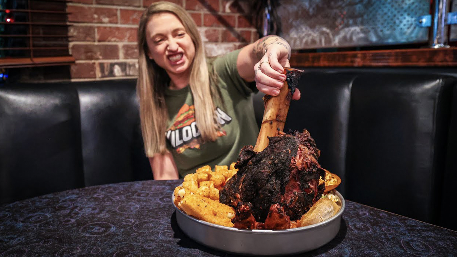 Woman attempts giant 8lb beef shank challenge loaded with BBQ sides