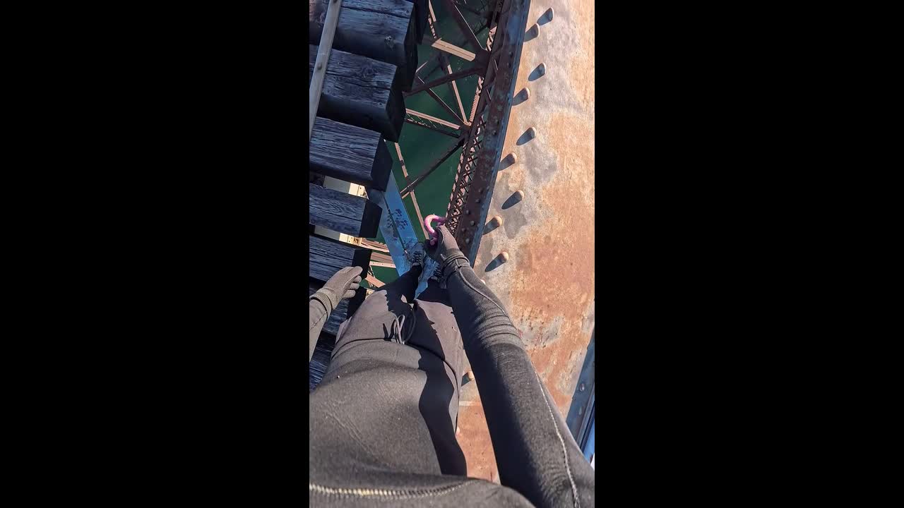 Man completes 22-meter bridge jump challenge into water in Montreal, Canada
