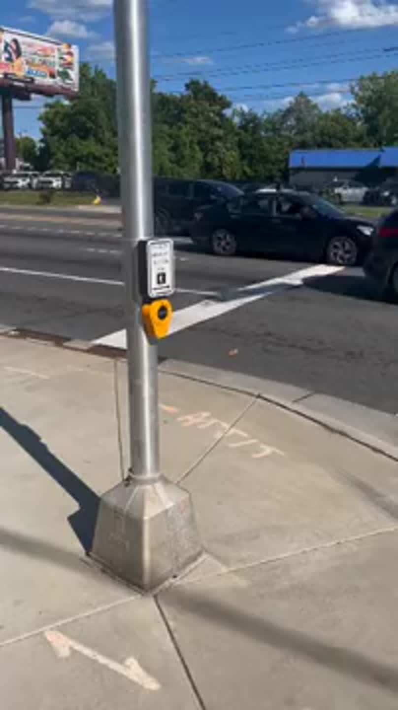 A pedestrian signal is missing at a busy North Tryon Street intersection