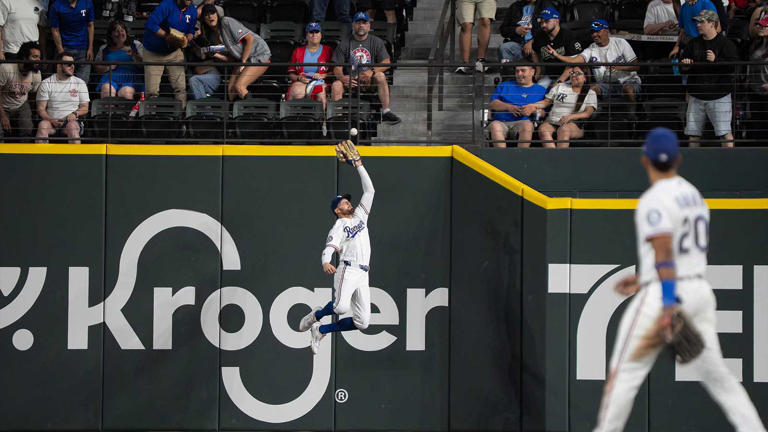 Rangers outfielder Brandon Nimmo gives Astros fan the ball from the ...