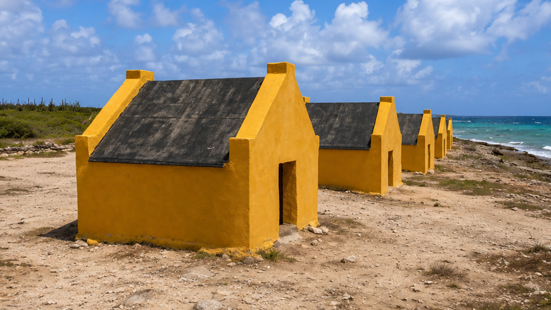 Why are these tiny yellow huts famous in Bonaire?