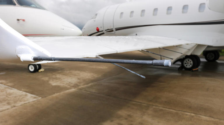 What are the metal rods on an airplane's wings called and what do they do?