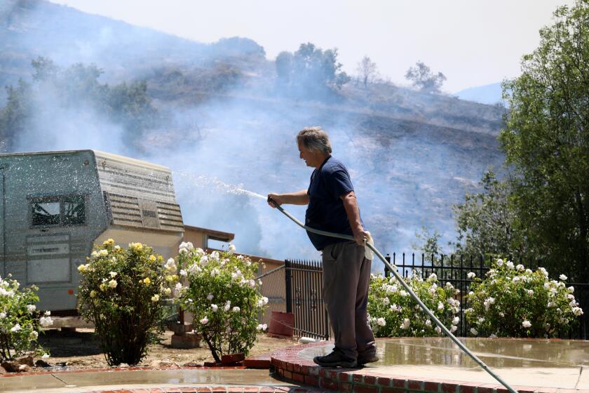 Sandy fire spreads, prompting evacuation warnings in LA County