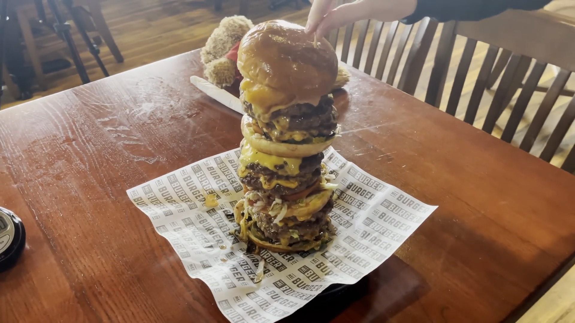 Man attempts giant 8-patty cheeseburger loaded with cheese curds