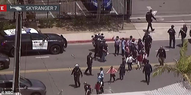 Five dead including security guard after two teenage gunmen open fire ...