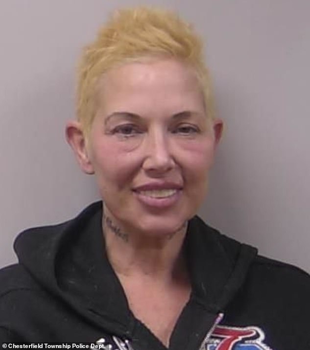 Eminem's unrecognizable ex-wife Kim cracks smile in latest mugshot ...