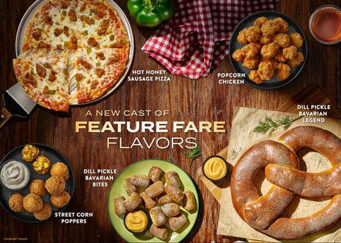 AMC rolls out pizza, pickles and corn poppers as part of theater menu