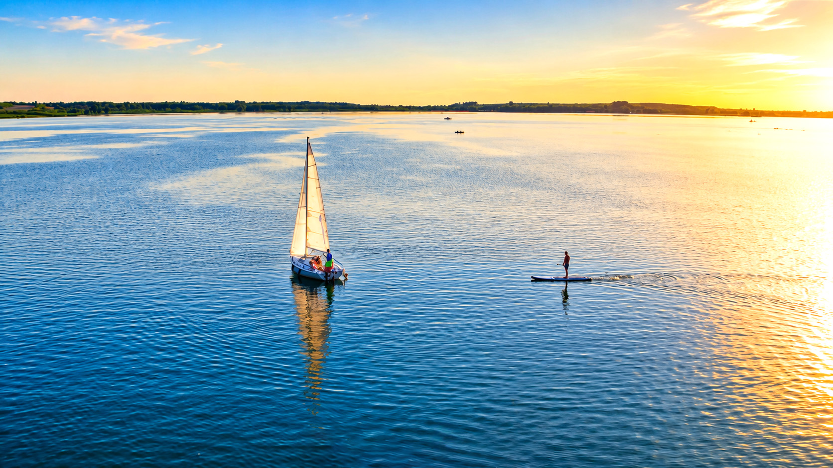 Sailing across Lake Palić as the sunset turns the water gold