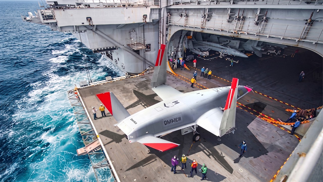 US launching futuristic giant drone on aircraft carrier at sea