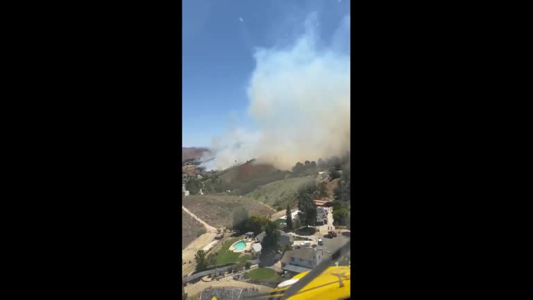 Aerial video shows towering smoke plume from California wildfire