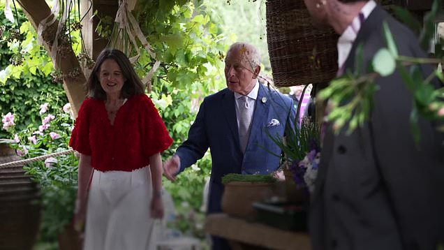David Beckham is all smiles as he meets the king at Chelsea Flower Show