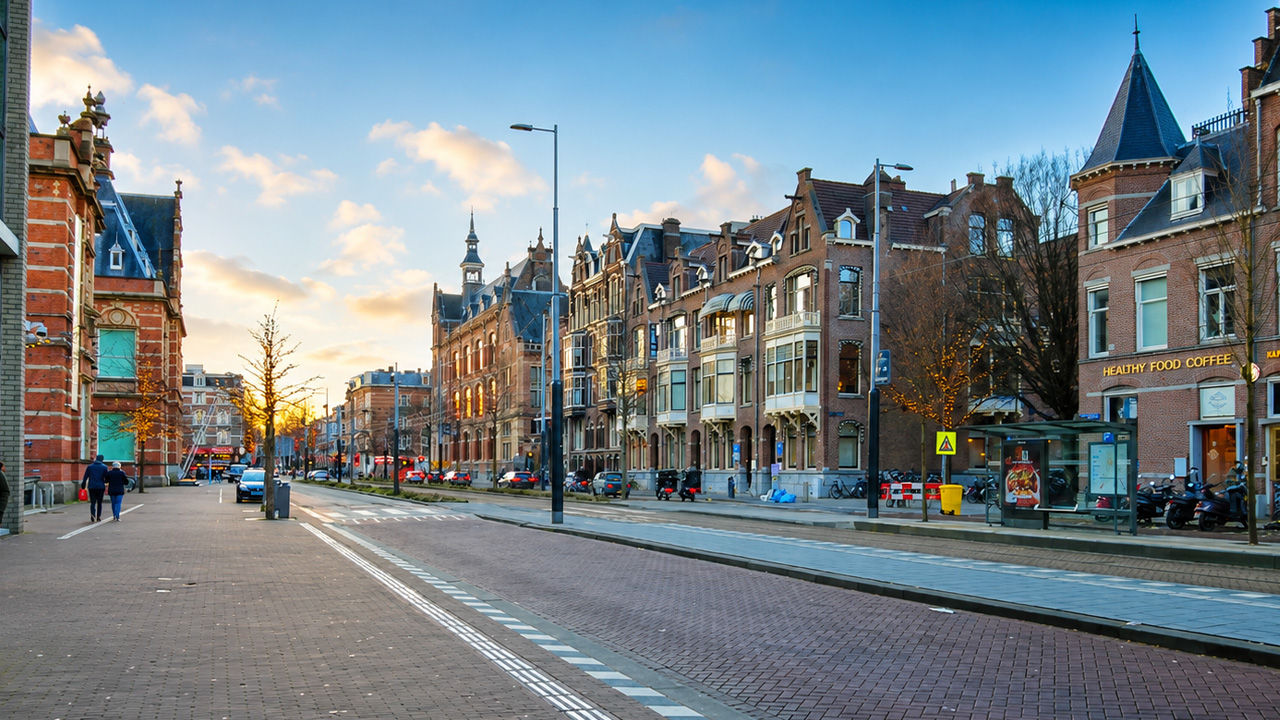Amsterdam walking tour through historic streets and city life