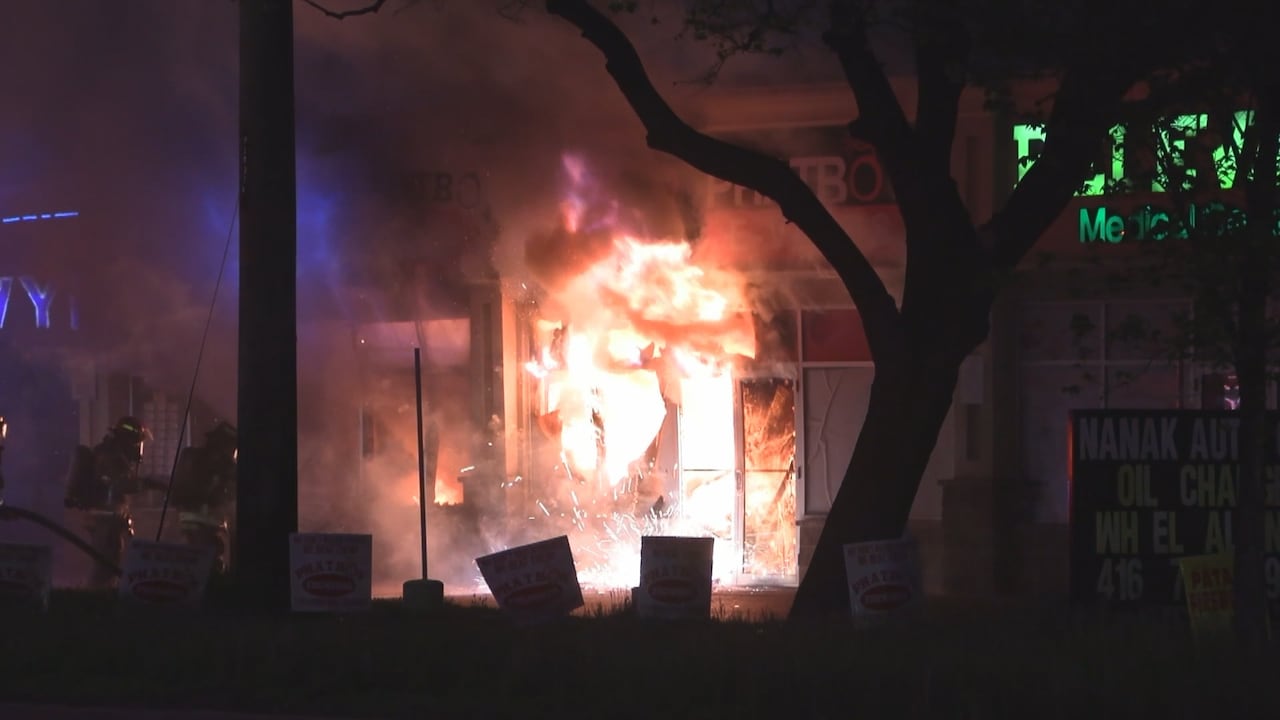 Crews put out 5-alarm blaze after car crashes into fireworks store ...