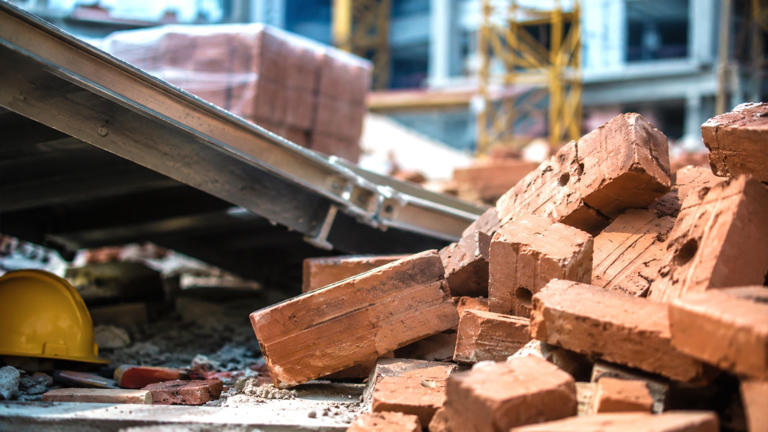 Site supervisor, 30, dies after the load of brick pallets collapses on ...