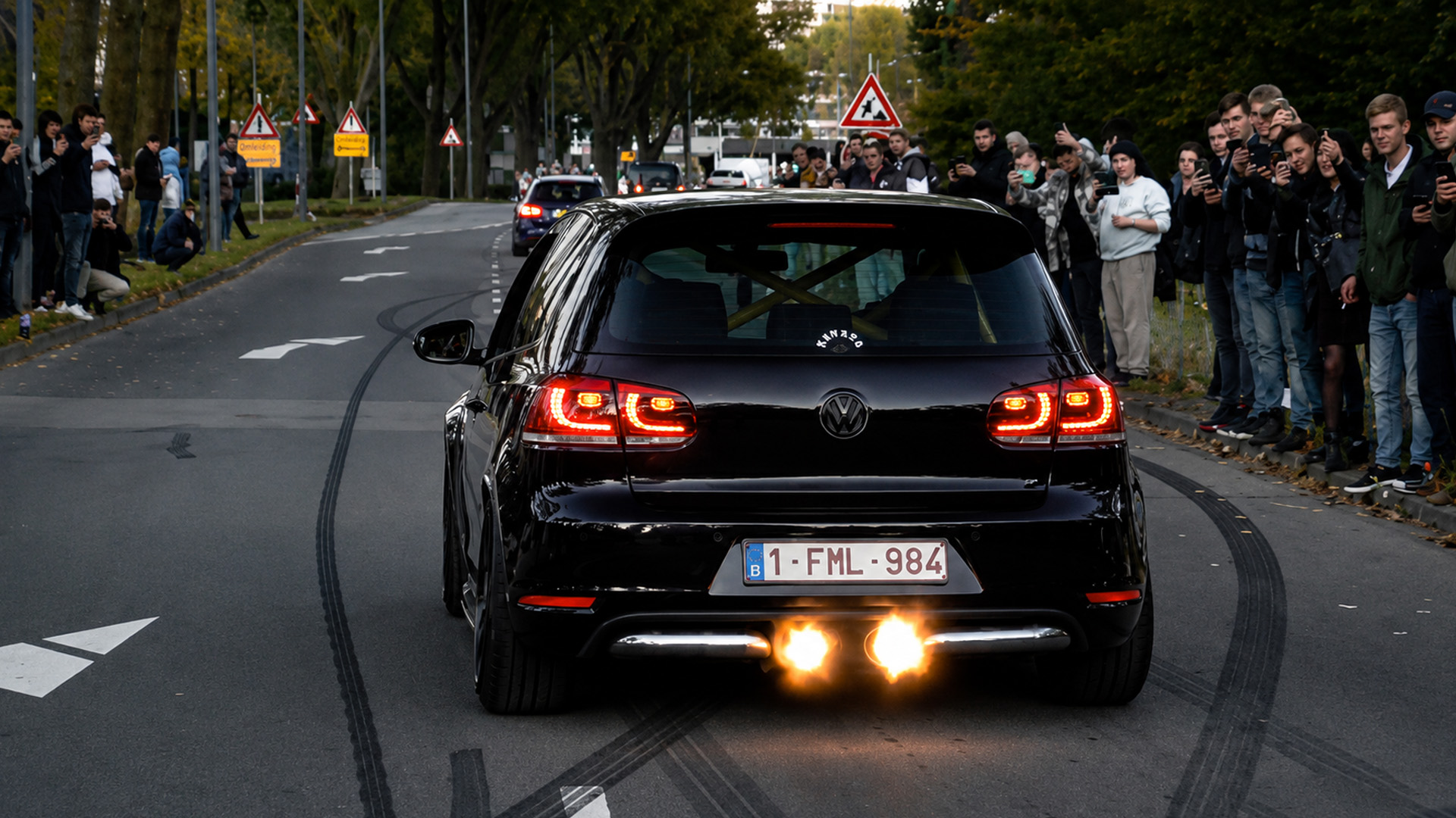 Volkswagen Golf shoots flames at crowded car meet