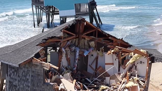 Beachfront homes torn down to stop them falling into the sea