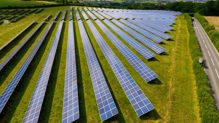 How many solar panels would it take to equal one nuclear reactor?