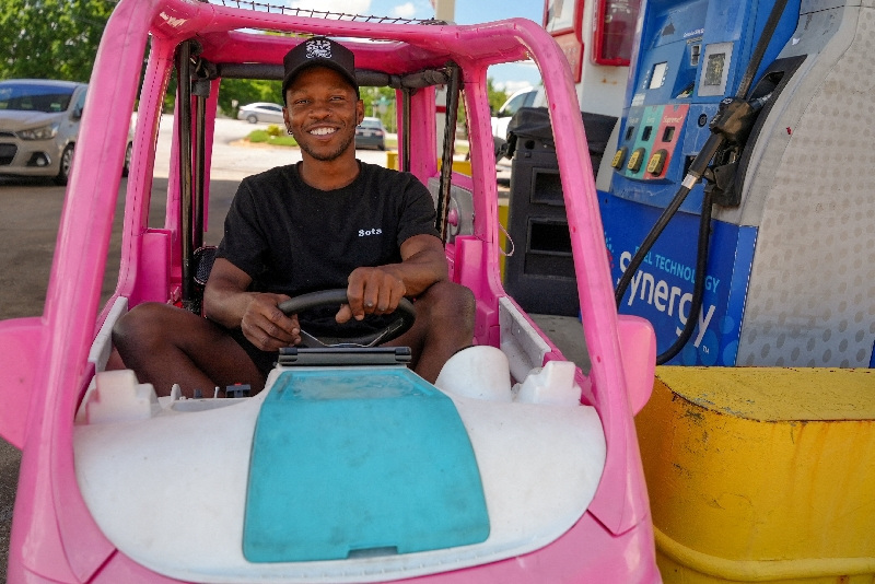 High gas prices spur Americans to improvise, from bus rides to toy cars
