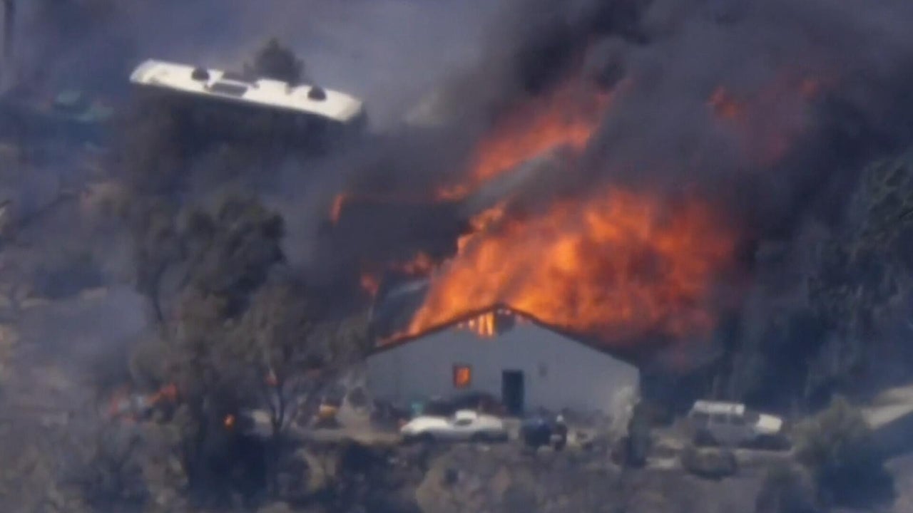 Eye opener: Fast-moving wildfire in California threatens homes