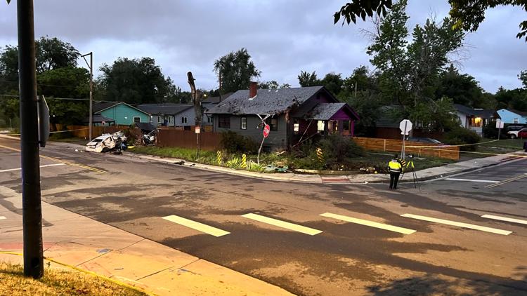 Driver injured after car hits Denver home