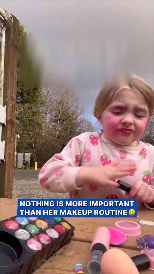 Little girl refuses to let storm interrupt makeup routine
