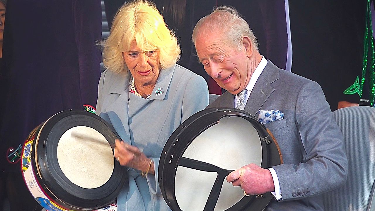 King and Queen play drums during royal visit to Belfast