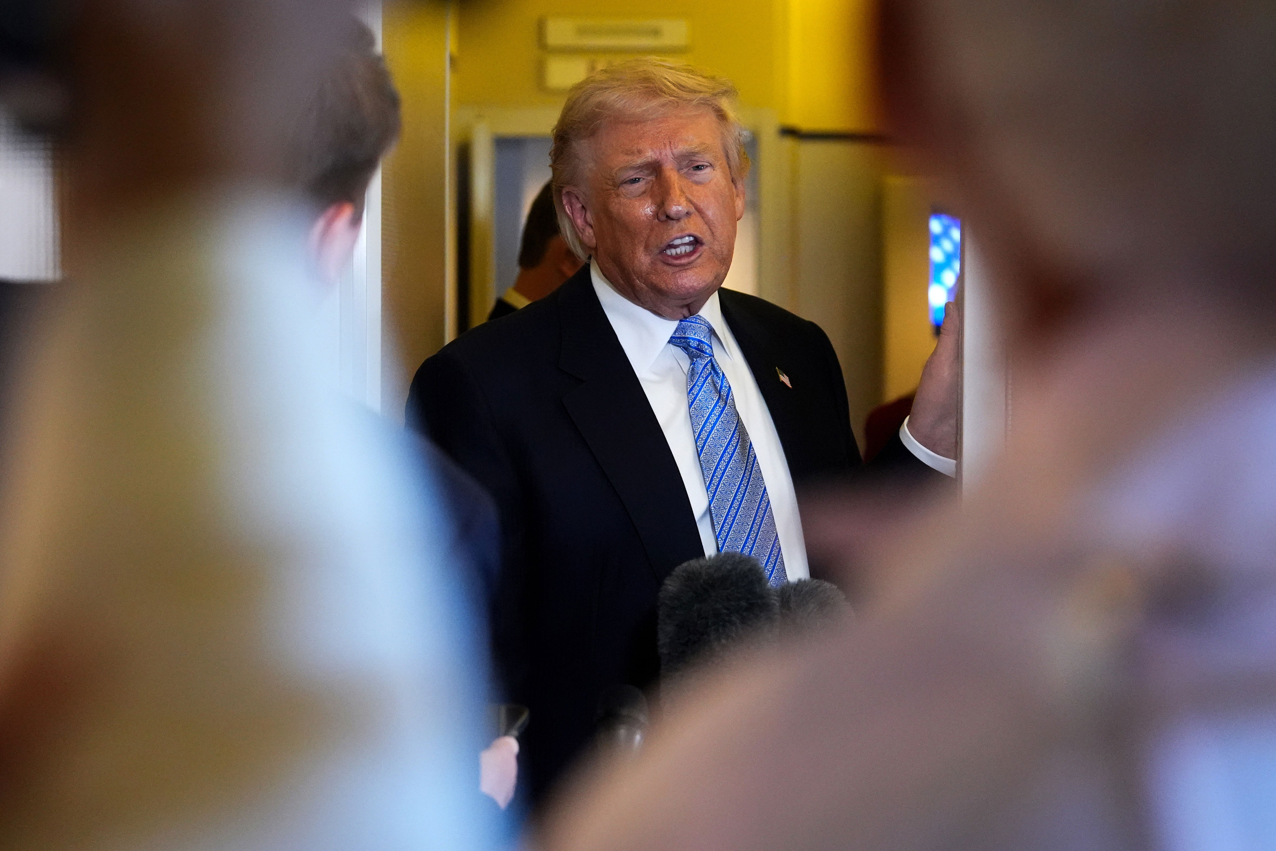 Justice Department expands Trump settlement to cover his tax audits