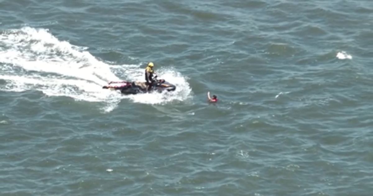 Four boaters and a dog rescued after boat capsizes near Oak Island