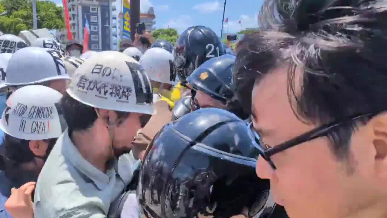 Protesters gather near Kadena Air Base in Okinawa, Japan