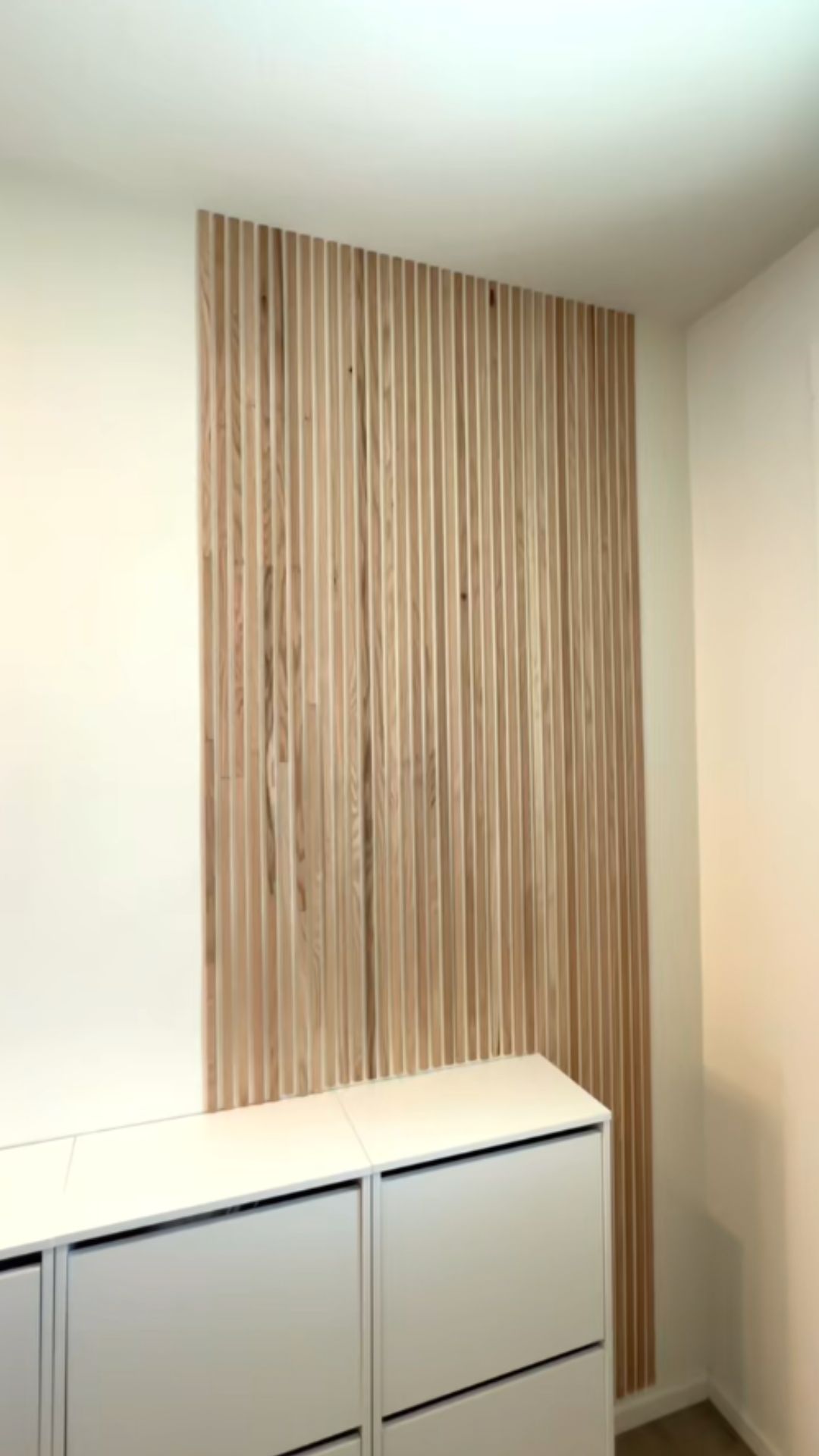 This wood slat entryway wall completely changed the space
