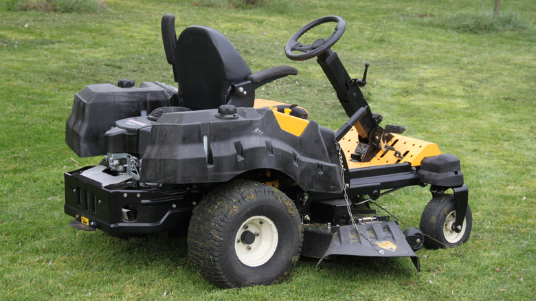 How are rear engine mowers different from lawn tractors?