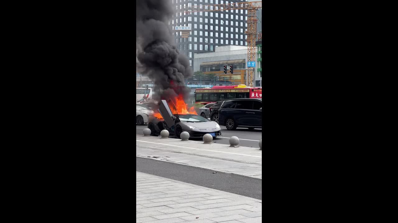 Lamborghini catches fire beside road in Guangzhou, Guangdong, China
