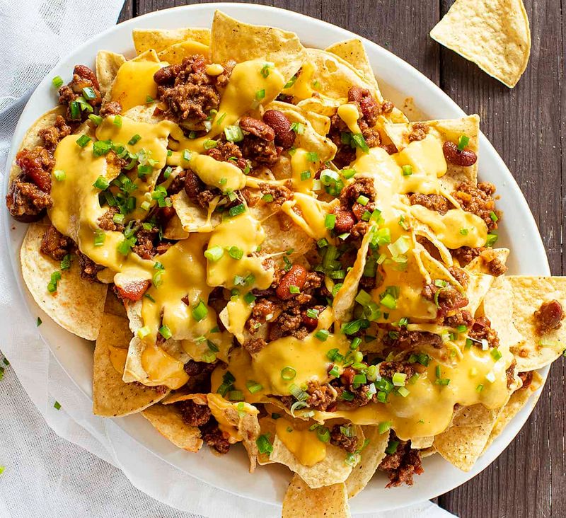 19 loaded nacho dishes that pile on the toppings